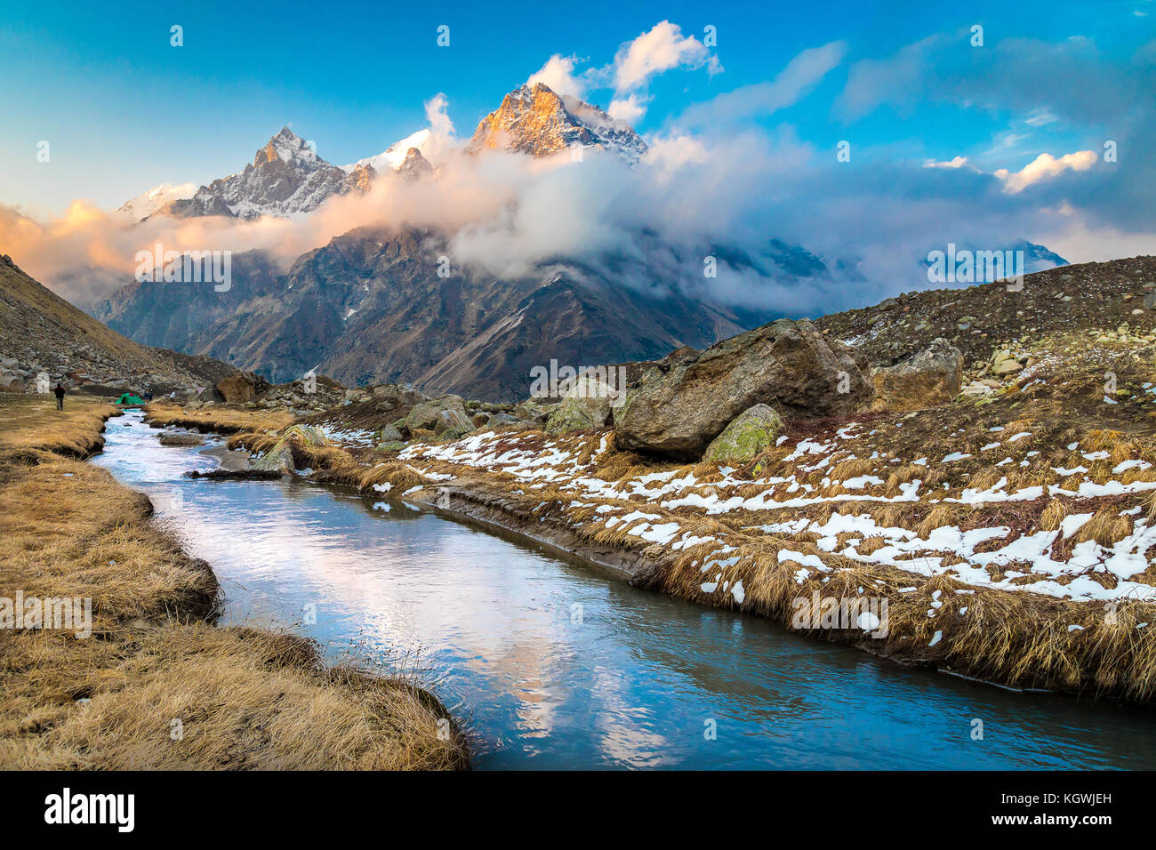 Tapovan during a colorful sunset with clouds floating across the valley ...