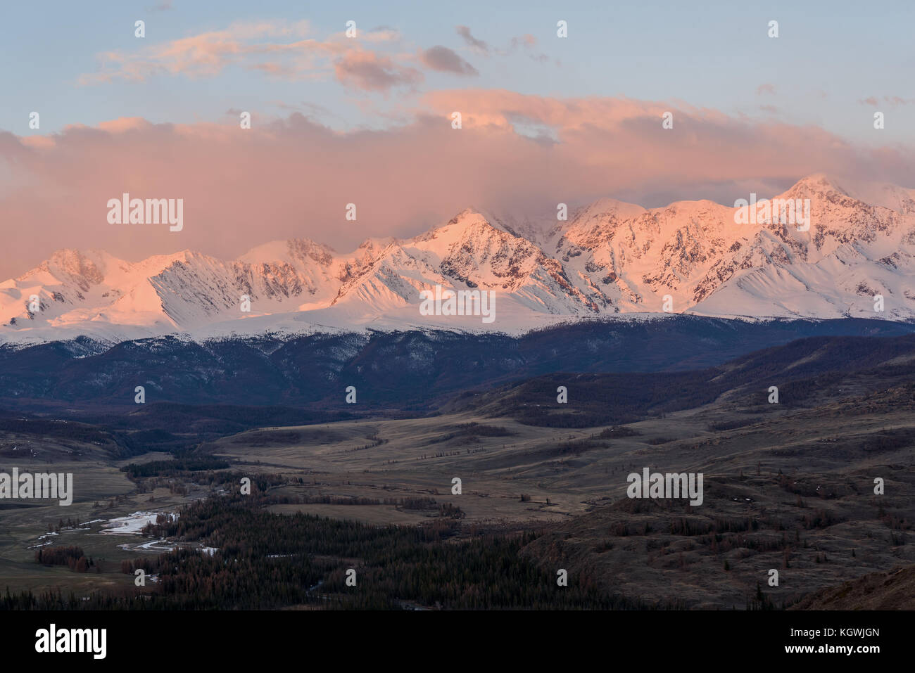 Scenic spring landscape with mountains covered with snow, valley ...