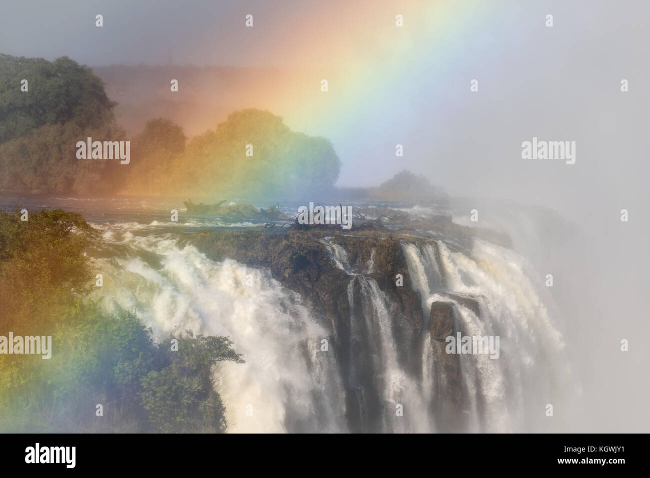Rainbow Over Victoria Falls Stock Photo - Alamy