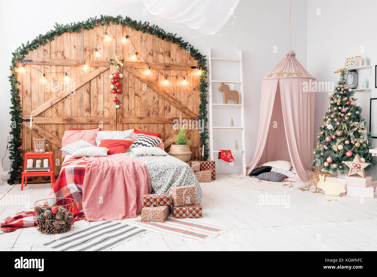 Xmas in morning bedroom. Double bed In christmas Interior on wood wall ...