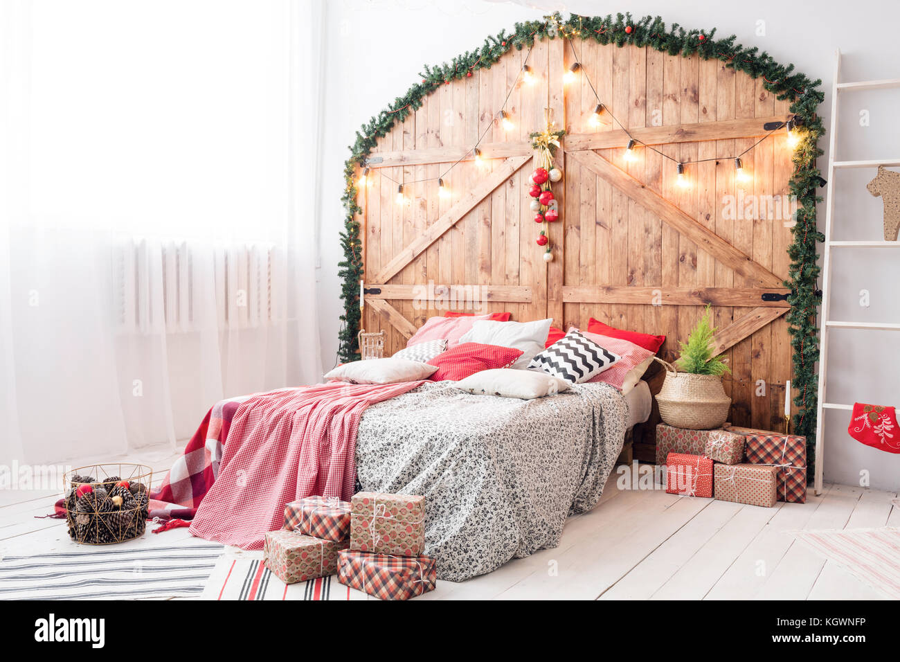 Xmas in morning bedroom. Double bed In christmas Interior on wood wall ...
