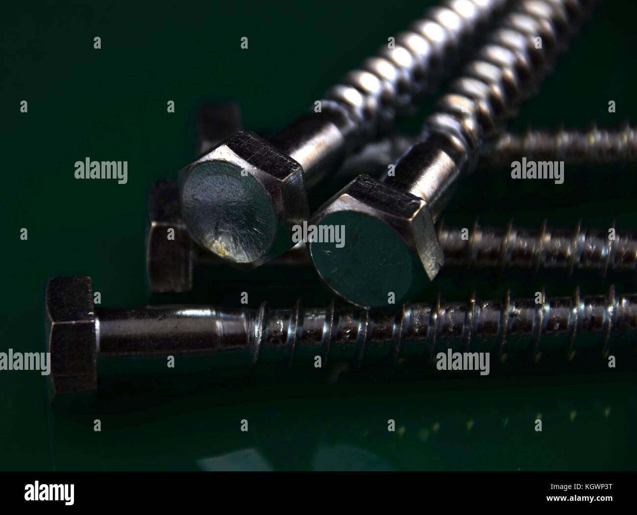 spanner or Hexagon head bolts with green Background and light ...
