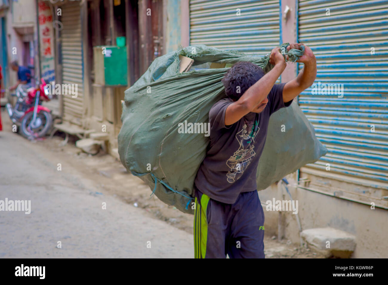 Indian man carrying sack hi-res stock photography and images - Alamy