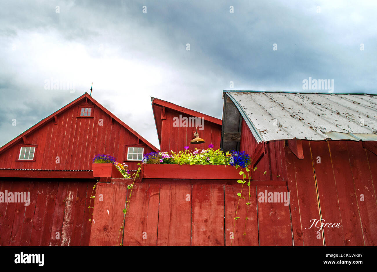 Red Barn with Flowers located in New York Stock Photo - Alamy