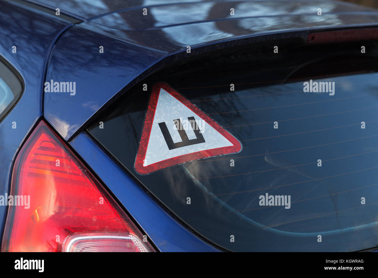 Sign "Studded tires" on the rear window of a car Stock Photo - Alamy