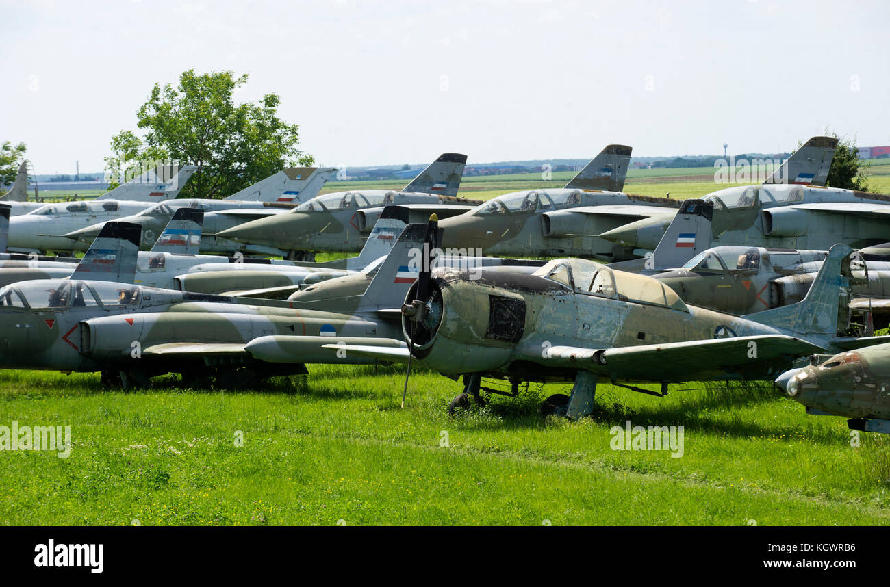 Old military fighter jets in the field Stock Photo - Alamy