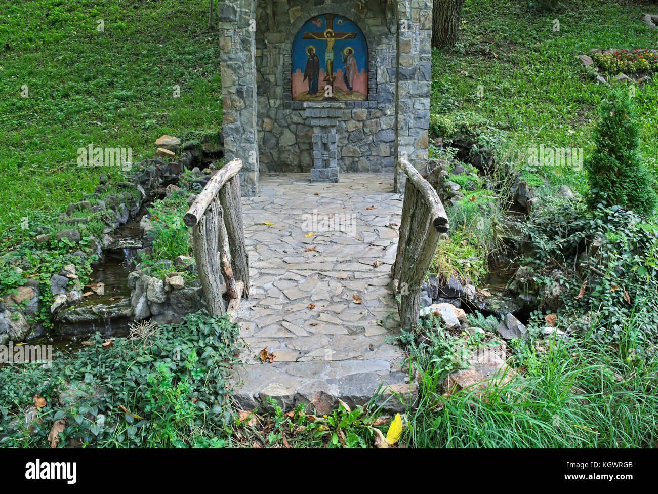 Small decorated stone christian monument in park Stock Photo - Alamy
