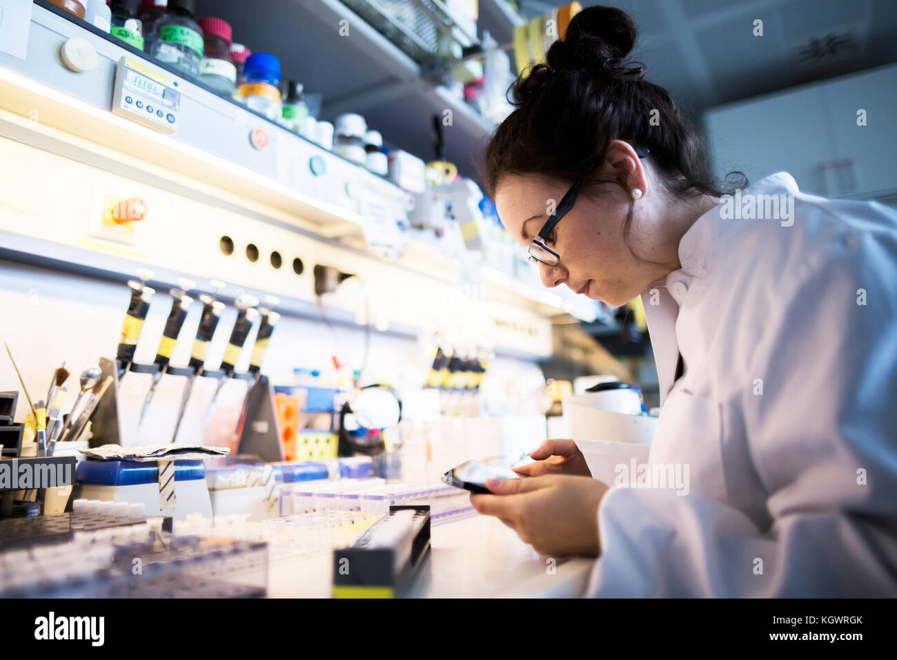 Female scientist working in a laboratory Stock Photo - Alamy