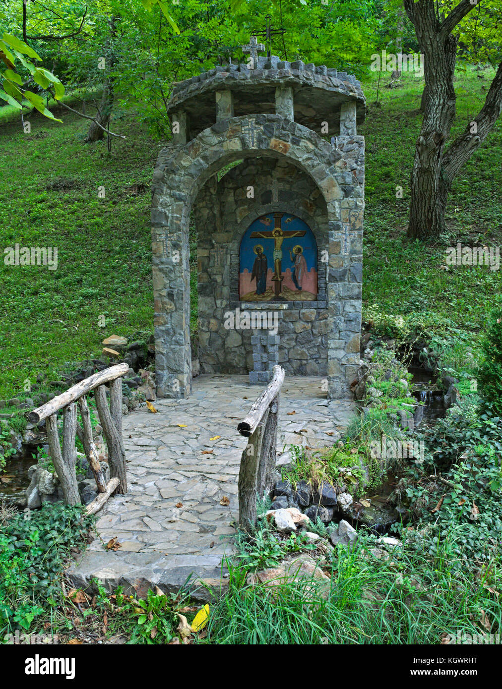 Small decorated stone christian monument in park Stock Photo - Alamy
