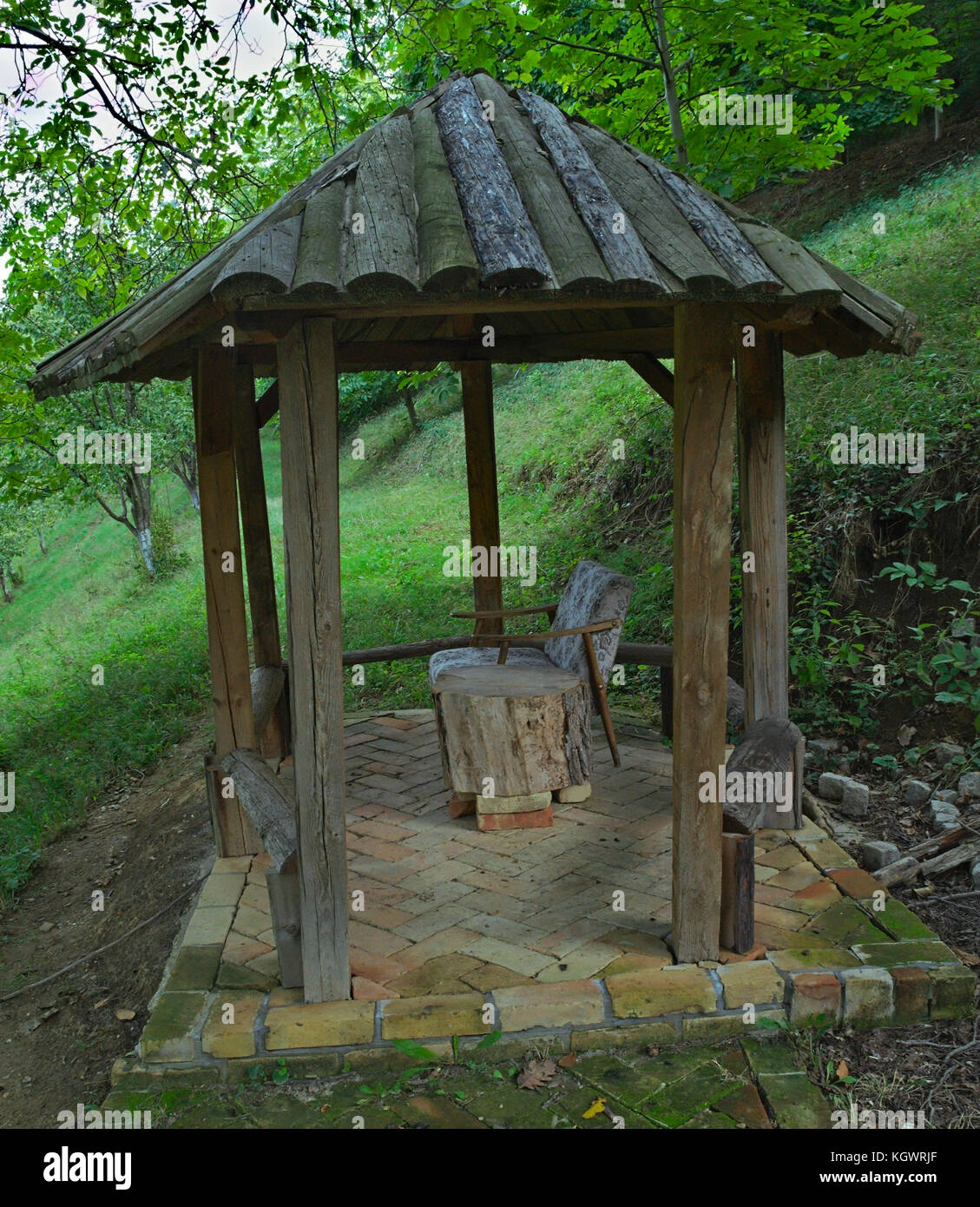 Wooden open hut for relaxing, in park Stock Photo - Alamy