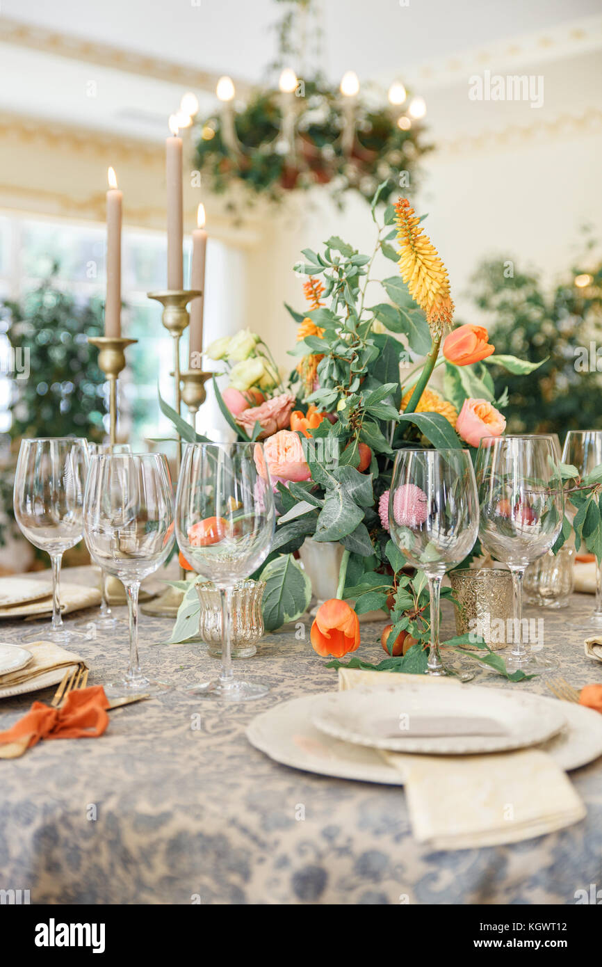 a dining table and comfortable armchairs in a modern house with a light ...