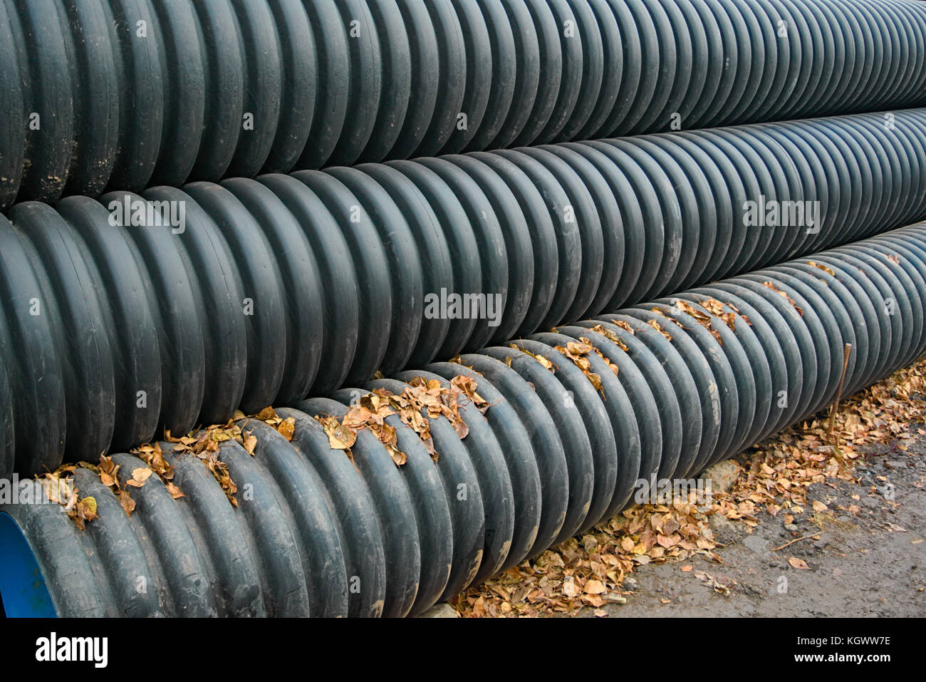 Pipes of PVC large diameter prepared for laying on construction site ...