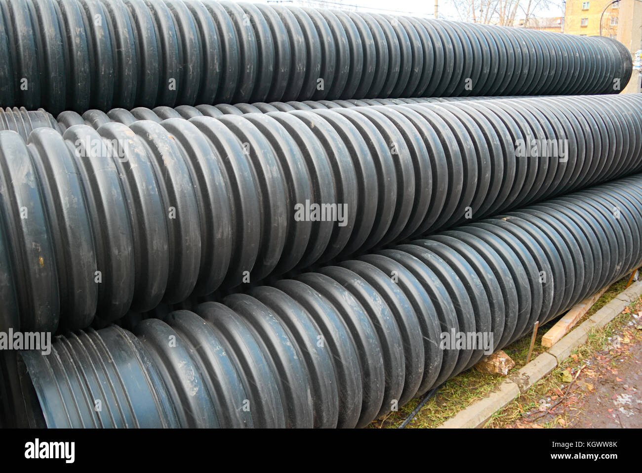 Pipes of PVC large diameter prepared for laying on construction site ...