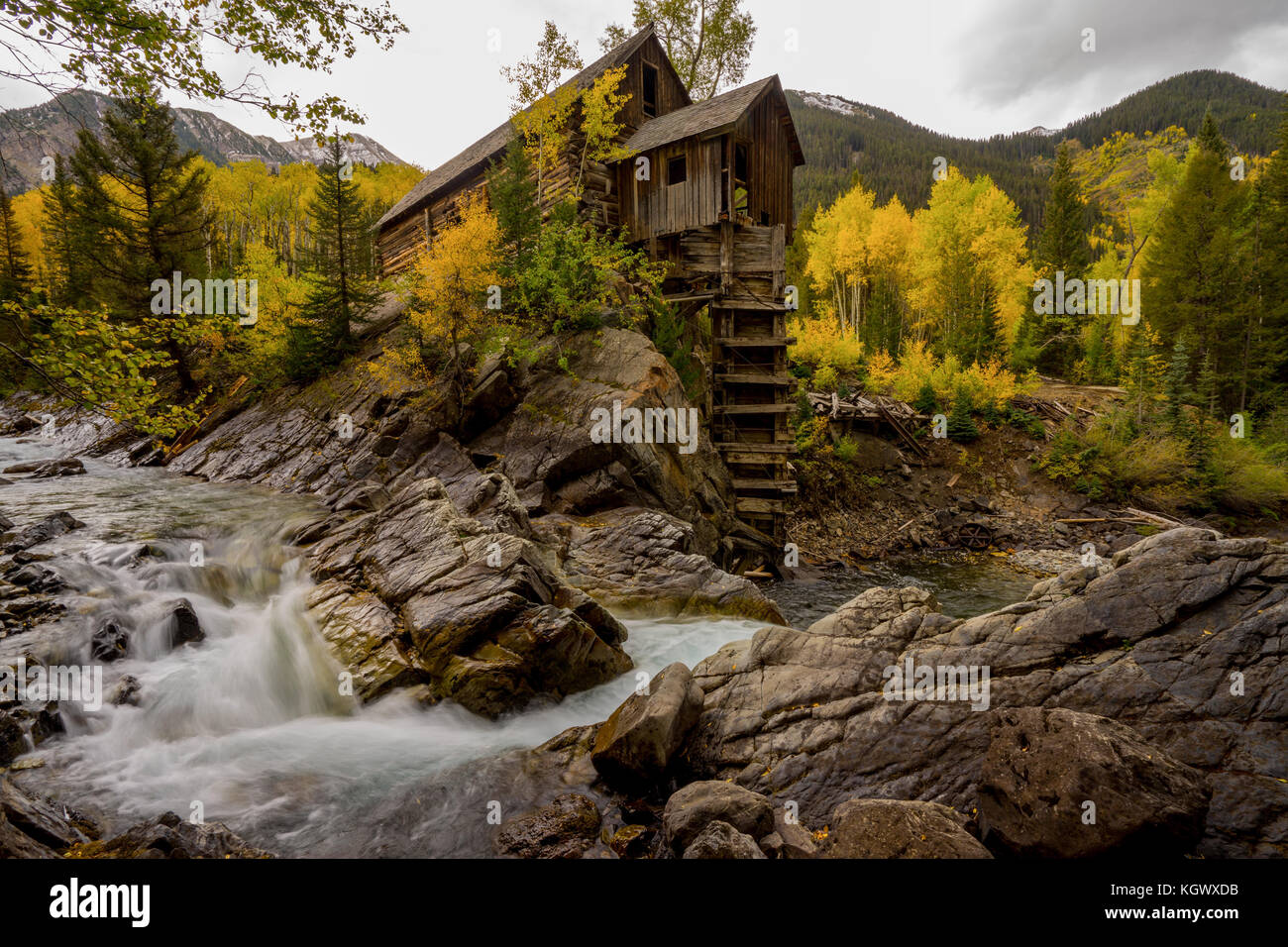 River Flows past an old mining mill in Colorado mountains Stock Photo ...