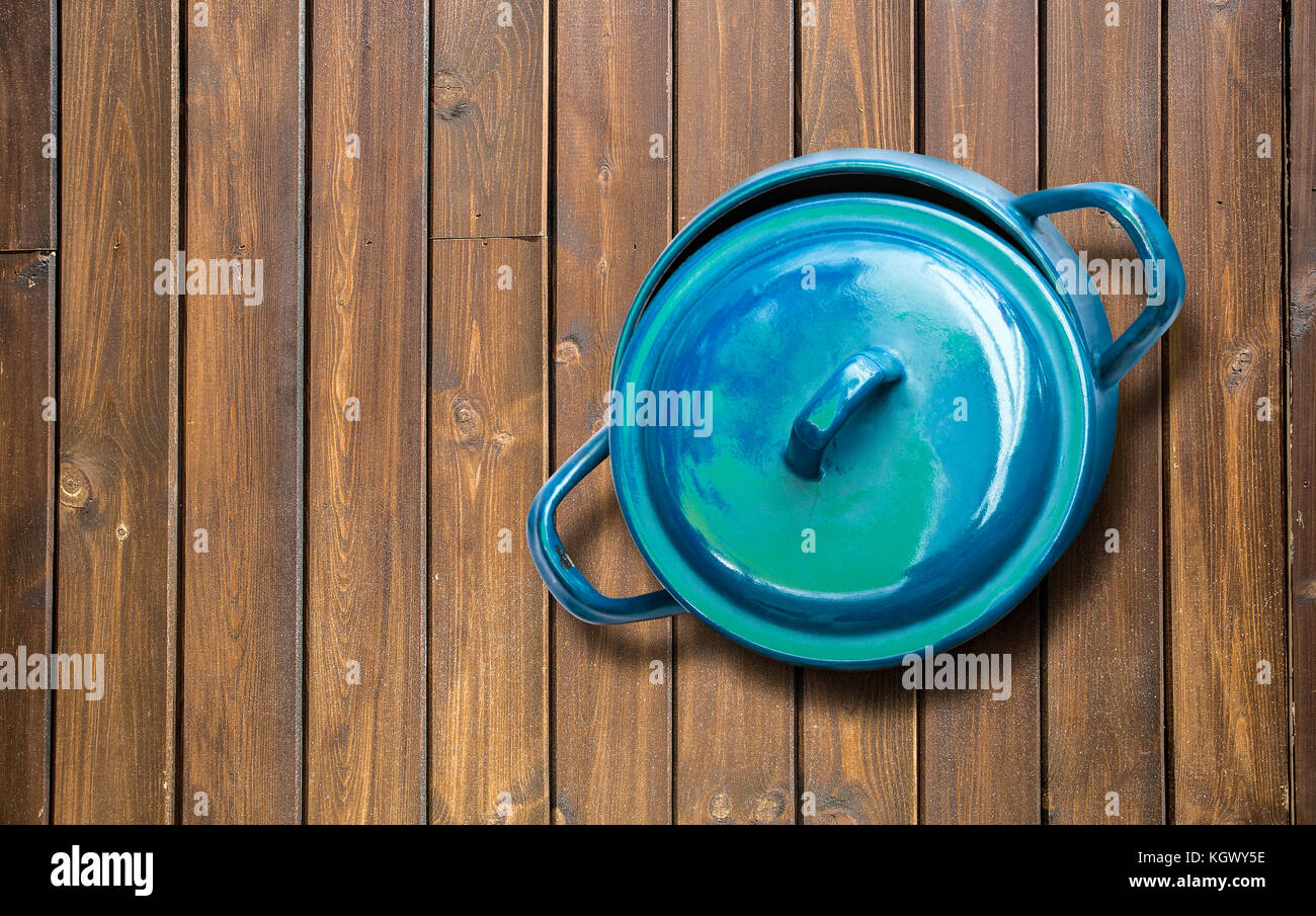 cooking pot on old wooden table Stock Photo - Alamy