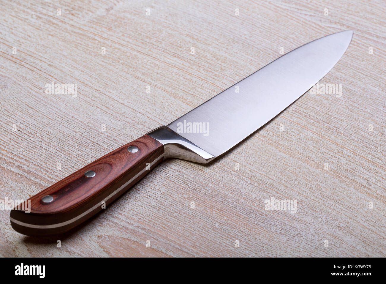 Knife on rustic kitchen table with copy space Stock Photo - Alamy