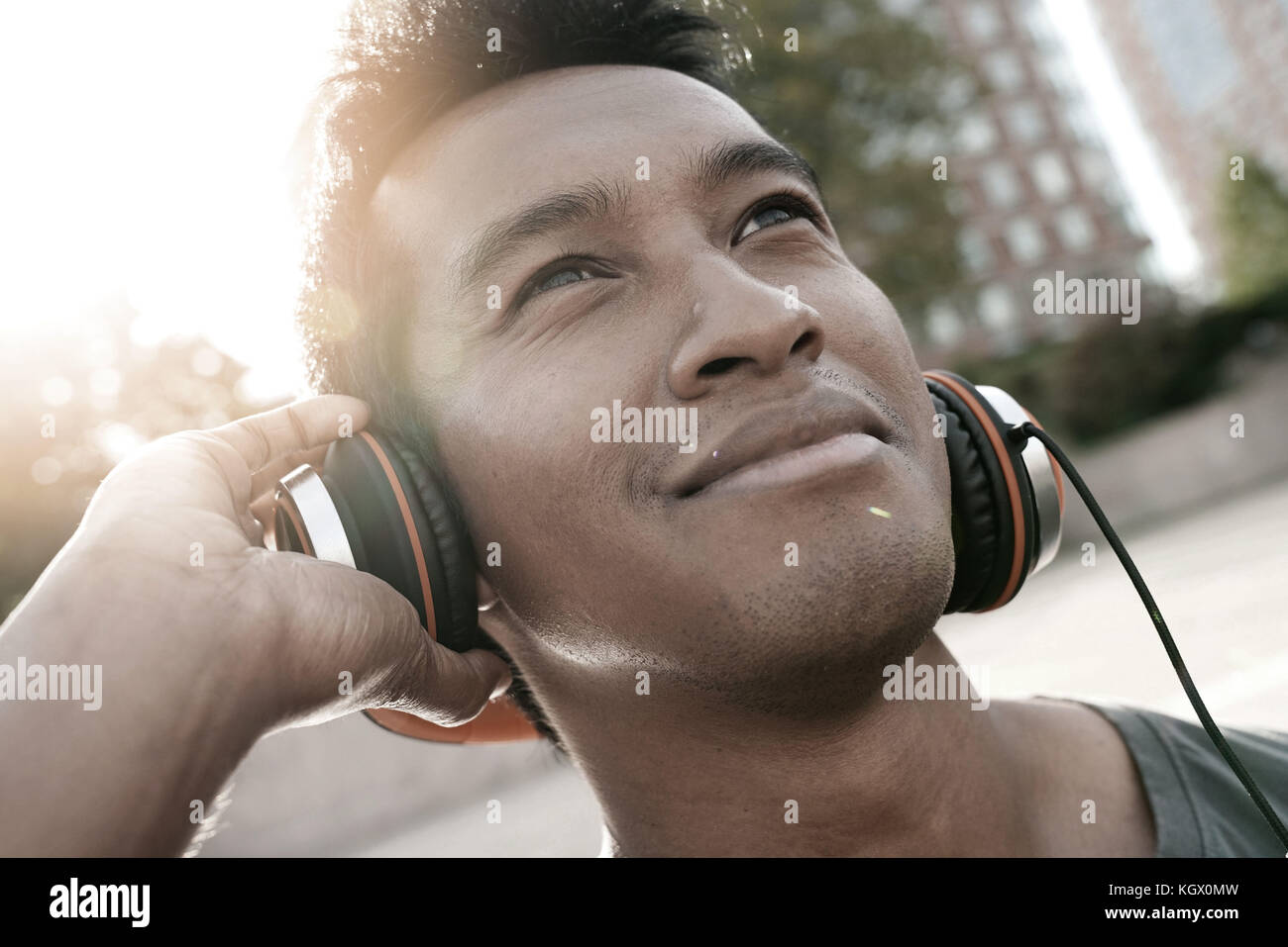 Portrait of smiling handsome asian guy with headset on Stock Photo - Alamy
