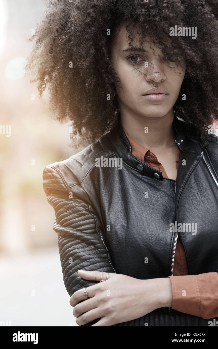 Portrait of mixed-raced girl in town Stock Photo - Alamy