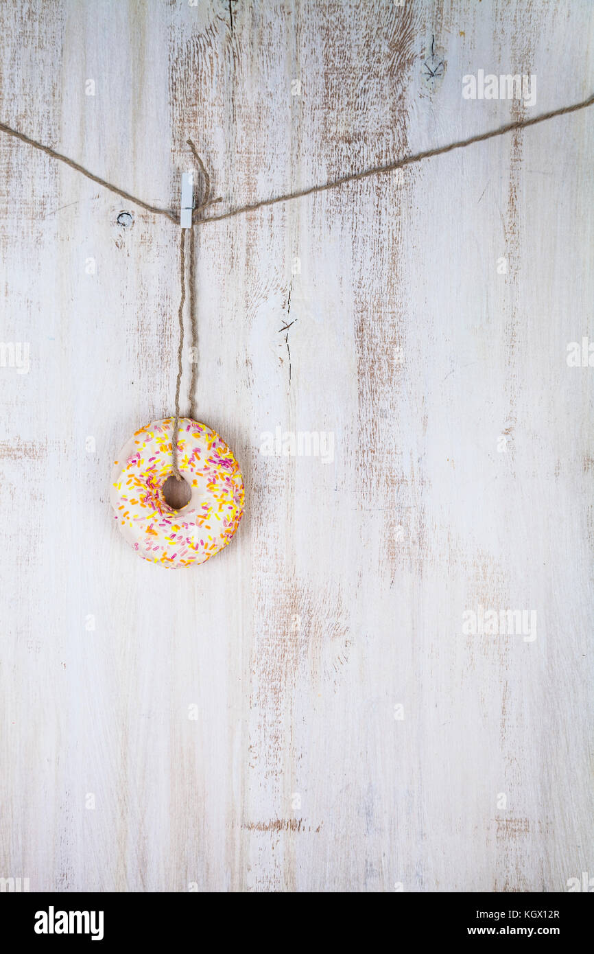 Donut on a rope on a wooden background. Delicious and sweet dessert ...