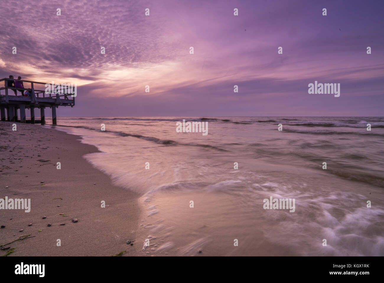 Sarbinowo, Poland - August 2017 : Picture of a sunset over wooden pier ...