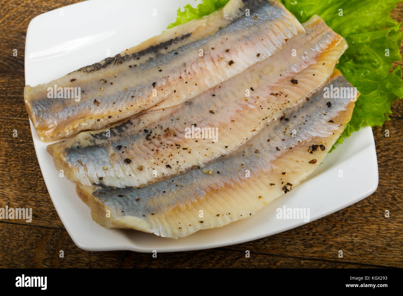 Herring fillet with pepper Stock Photo - Alamy