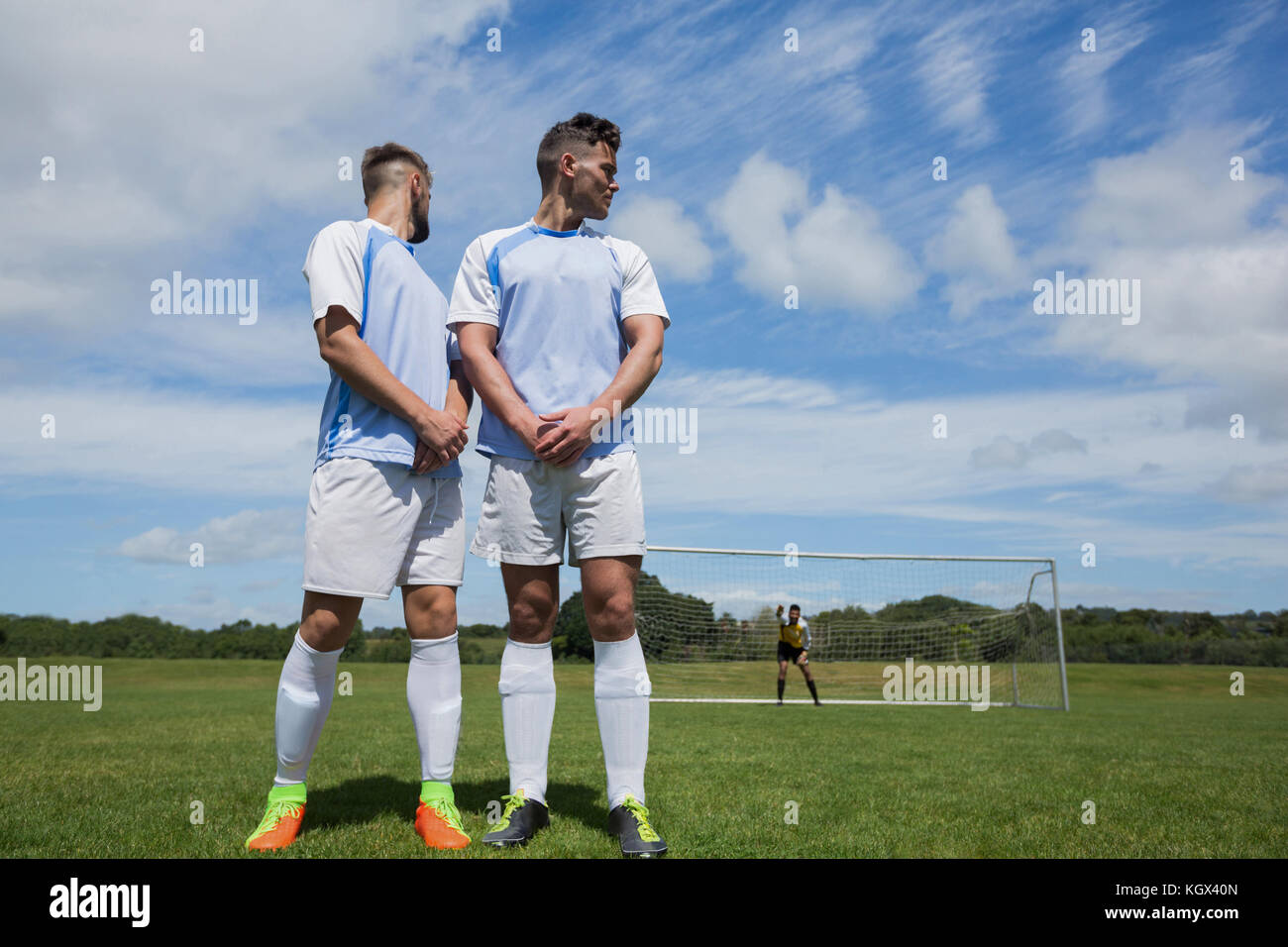 Football players standing in the ground on a sunny day Stock Photo - Alamy