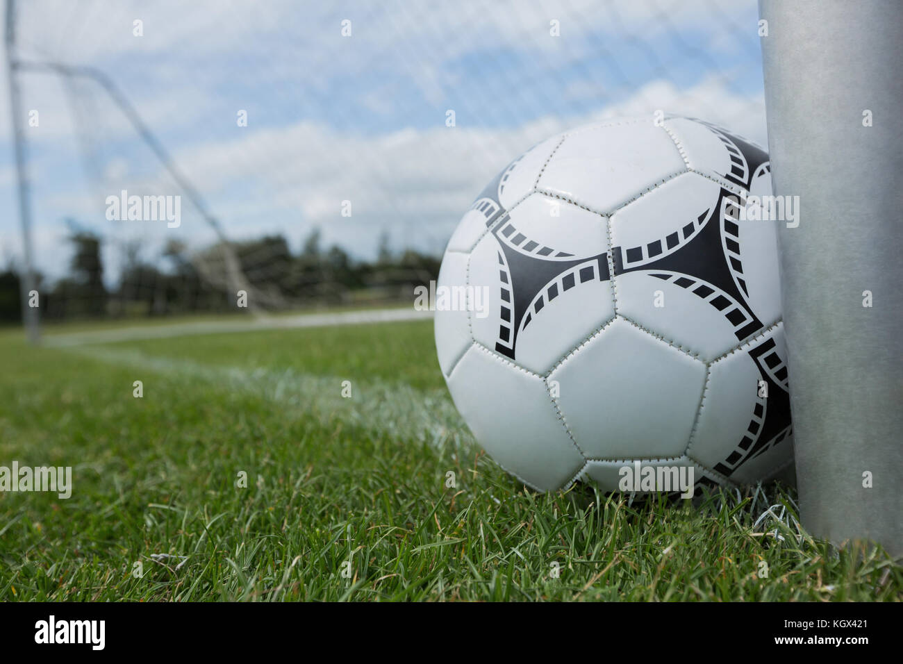 Soccer ball near goal post hi-res stock photography and images - Alamy