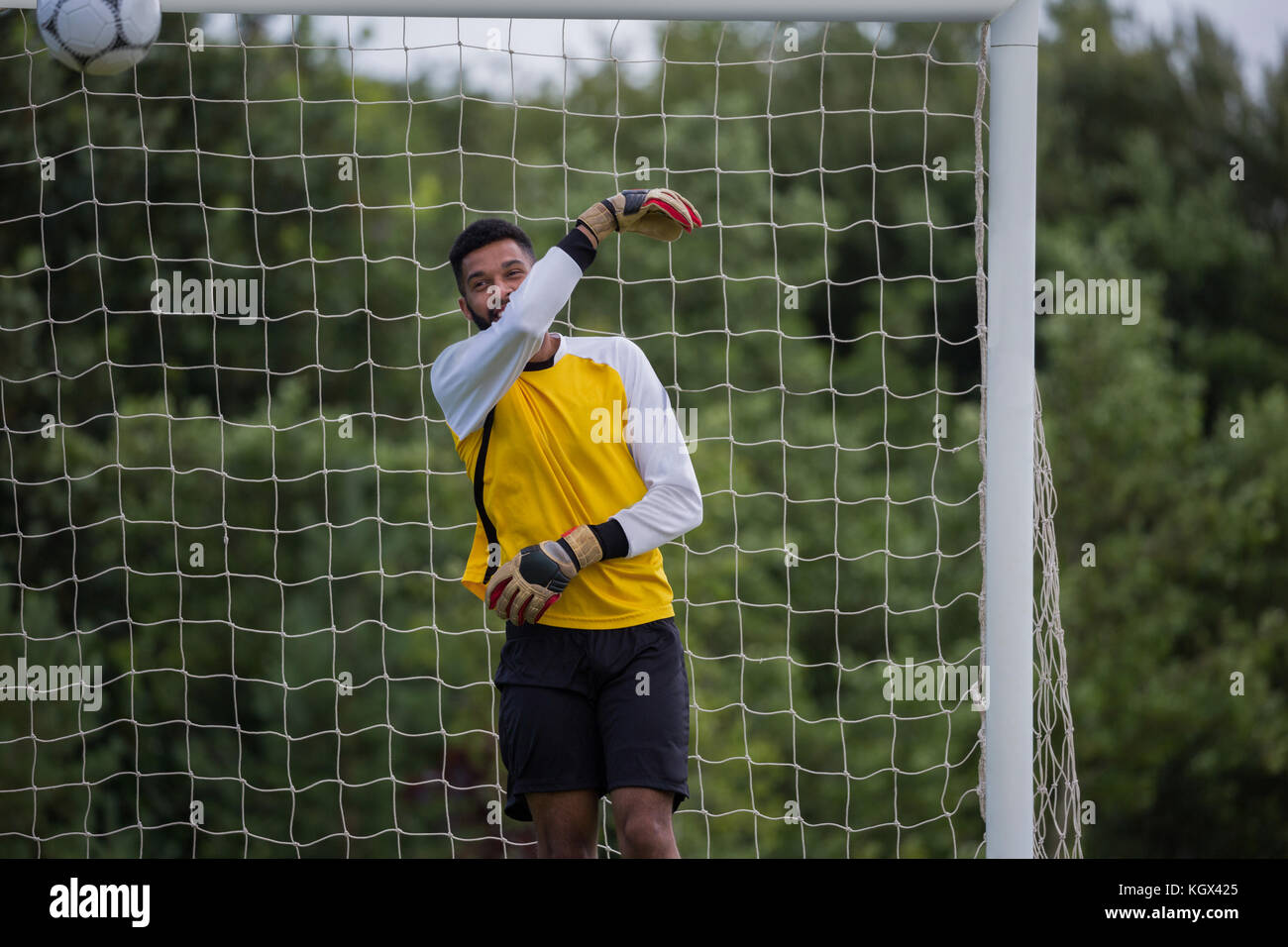 Smiling goalkeeper hi-res stock photography and images - Alamy