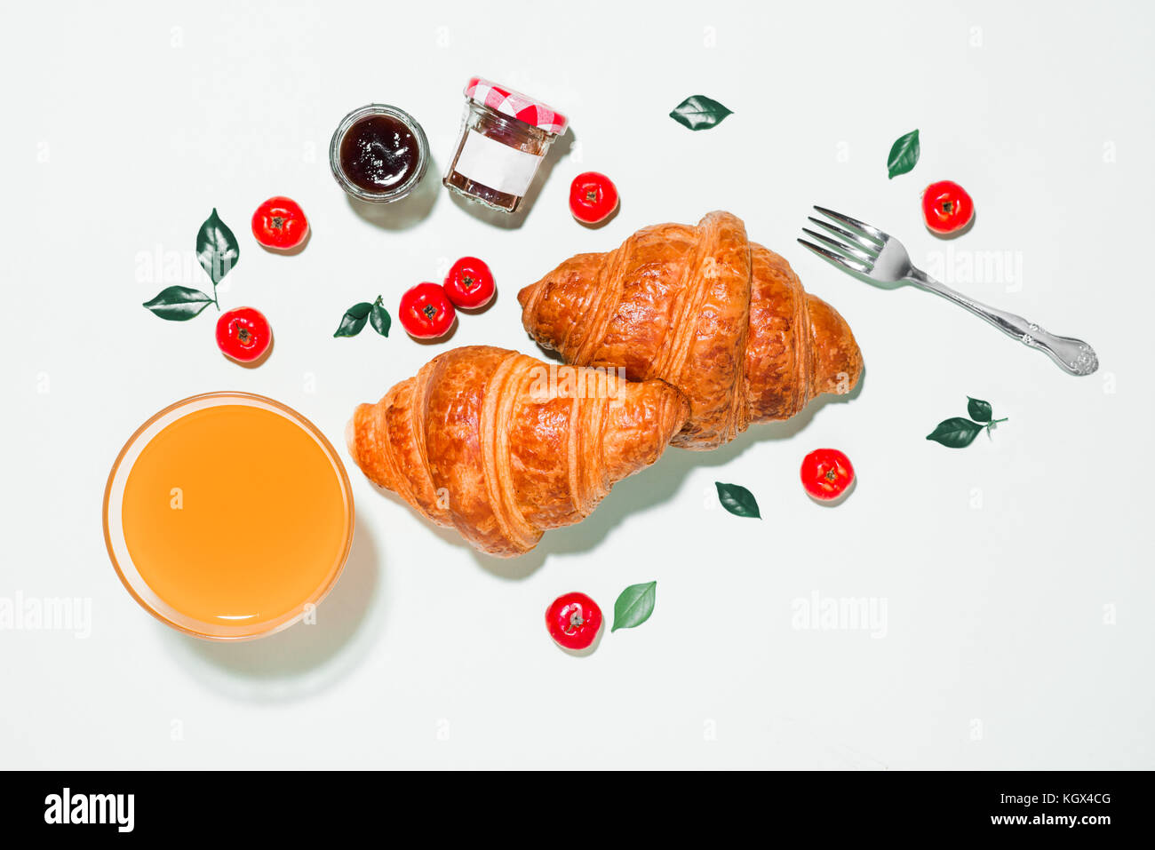 Breakfast with fresh croissants and orange juice, top view Stock Photo ...