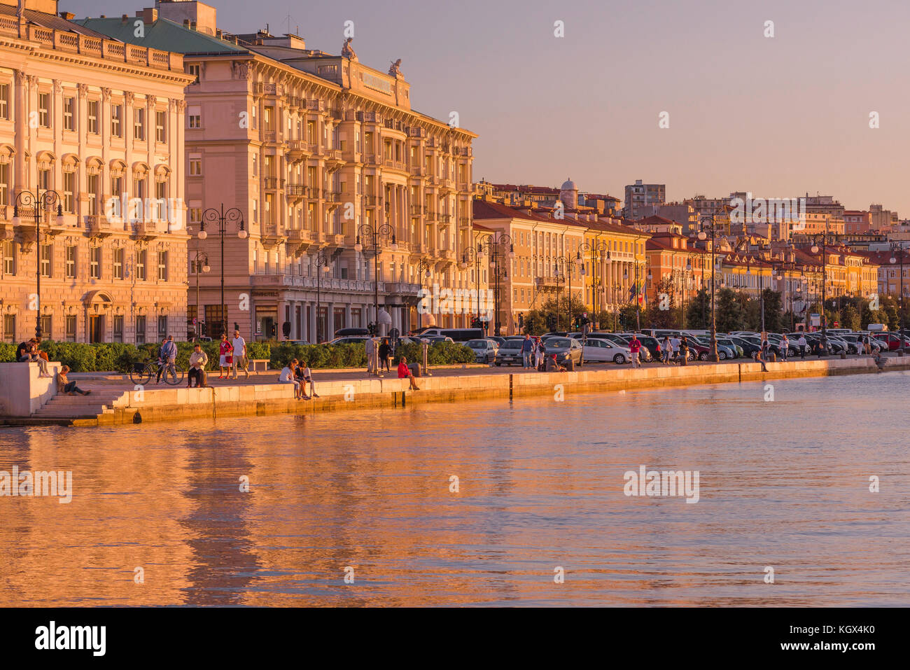 Trieste waterfront, a summer sunset illuminates hotels along the ...