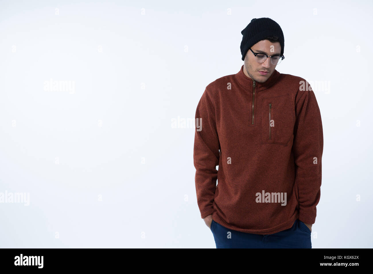 Depressed man standing against white background Stock Photo - Alamy