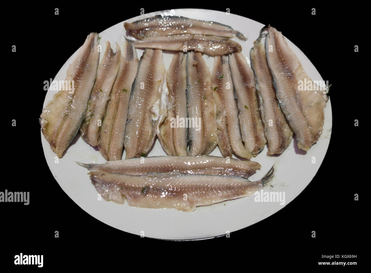 Raw anchovy plate prepared with vinegar Stock Photo - Alamy