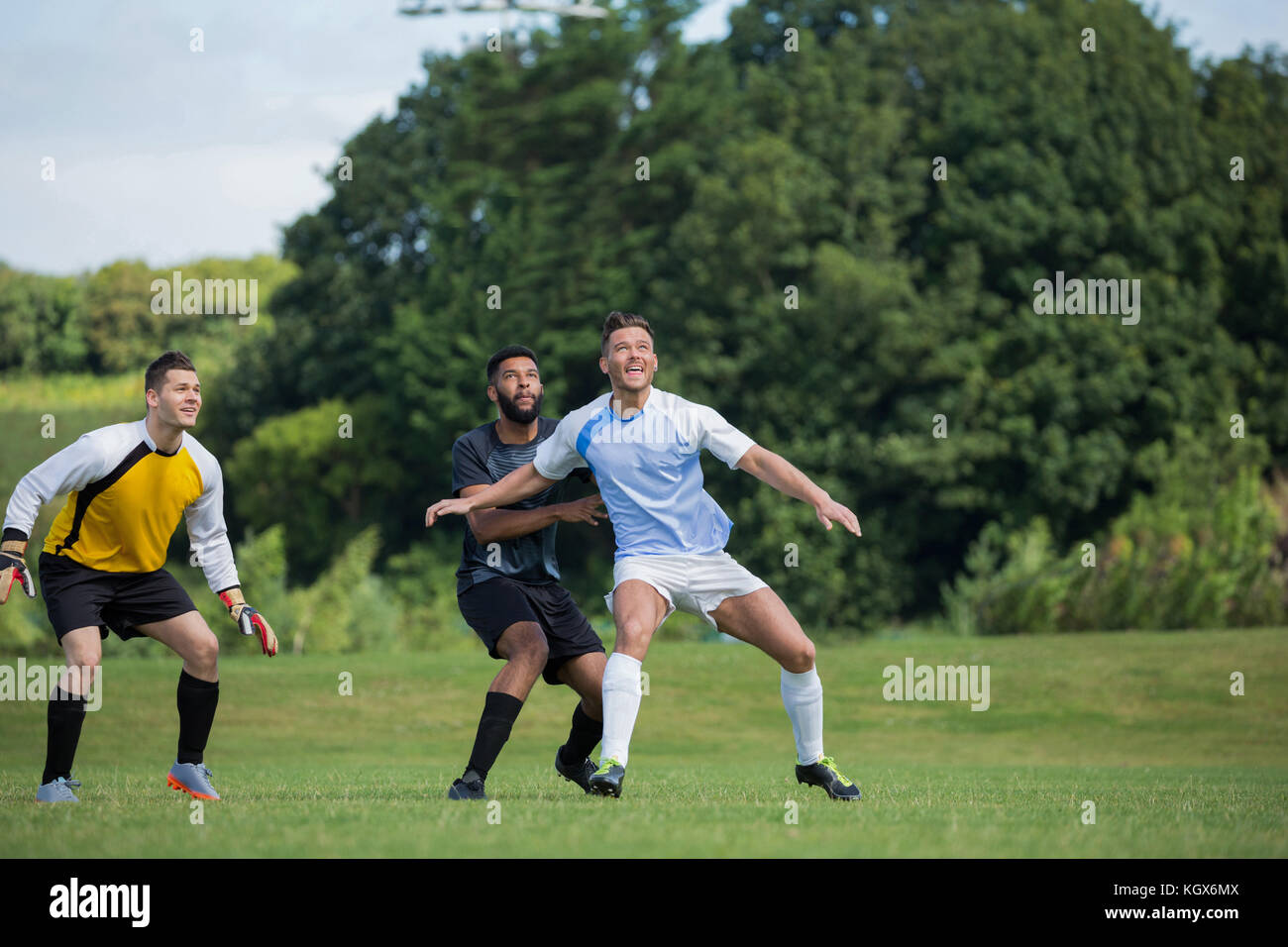 Football players playing soccer in the ground on a sunny day Stock ...