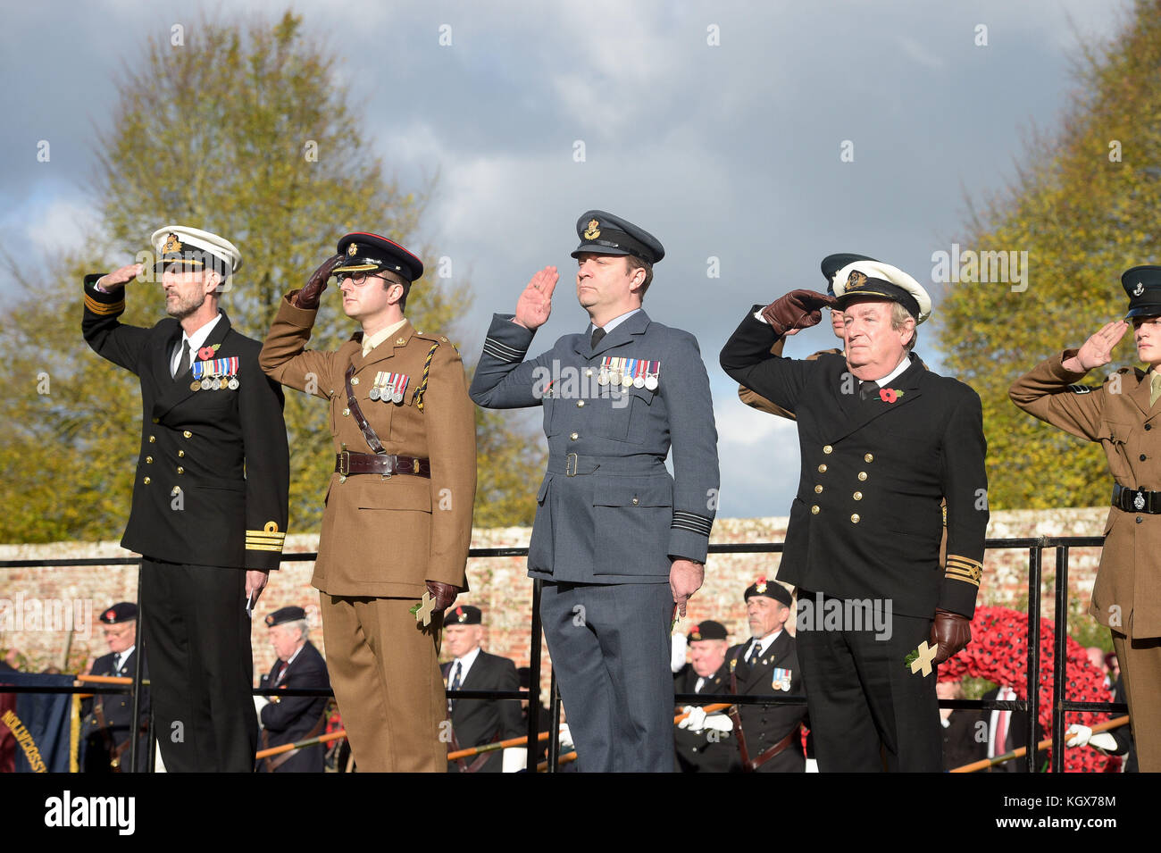 Members of the Armed Forces salute after a minutes silence in the Royal ...