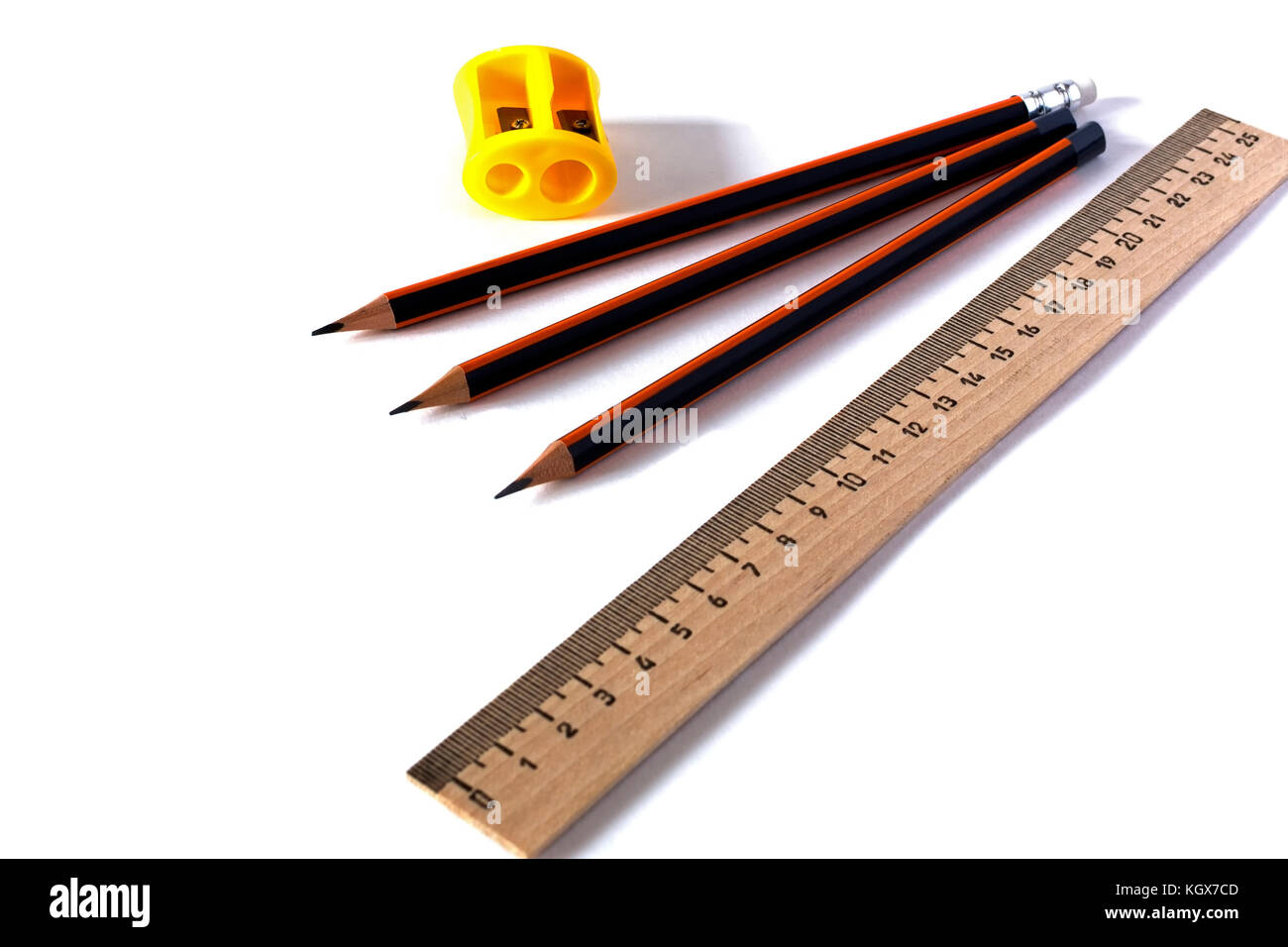 Stationery - Wooden school ruler, sharpener and three graphite pencils ...