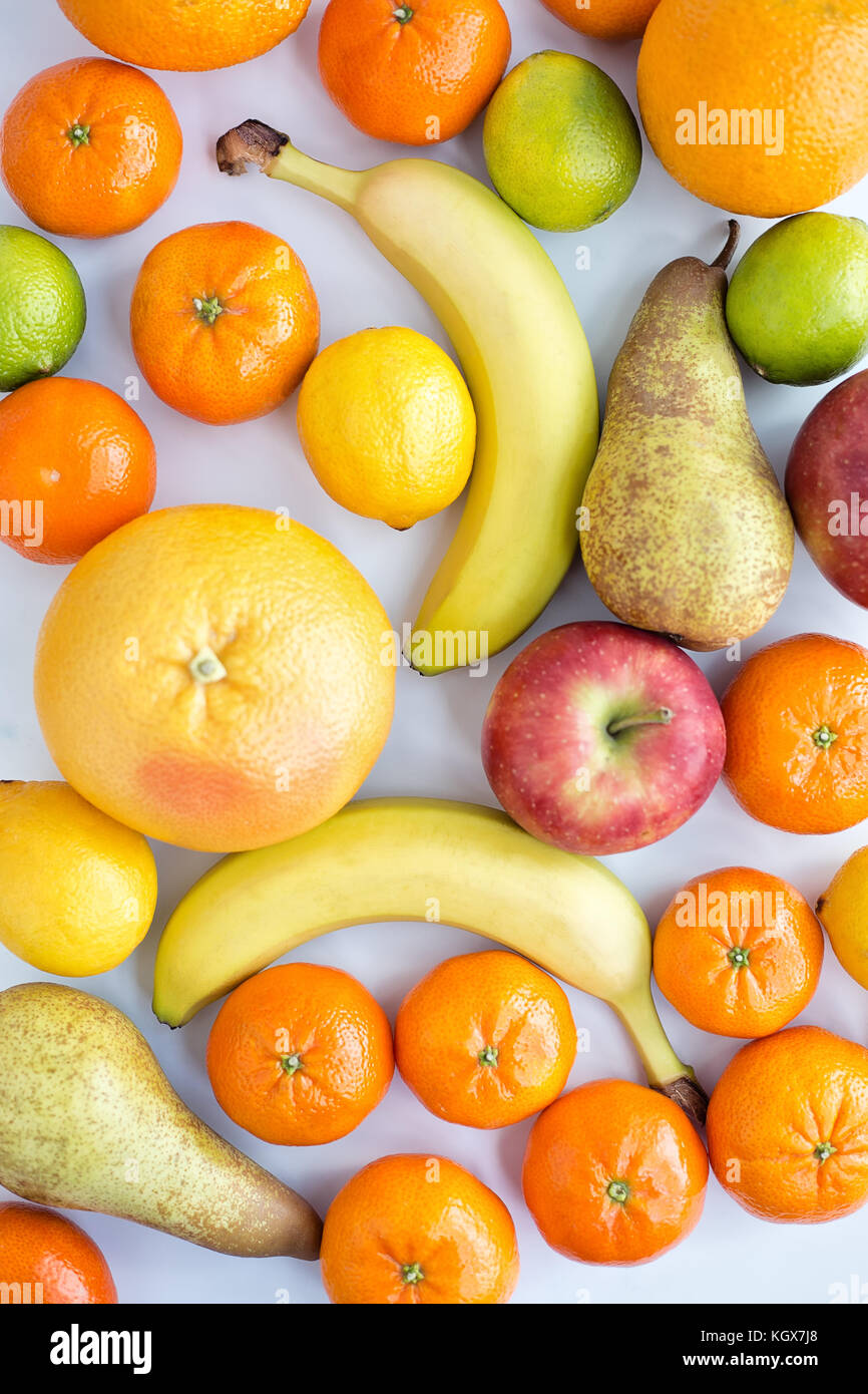 Variety of fruits, apples, tangerines, bananas, pears, lemons, limes ...