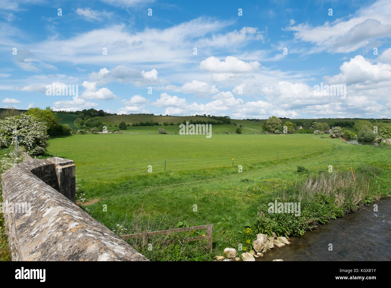The River Windrush flowing under the bridge at Ninety Cut Hill leading ...