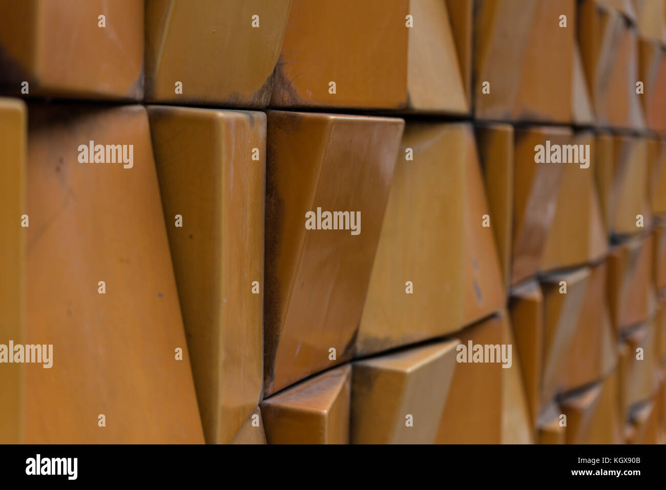 Shallow depth of field shot of worn decorative brick exterior wall in ...