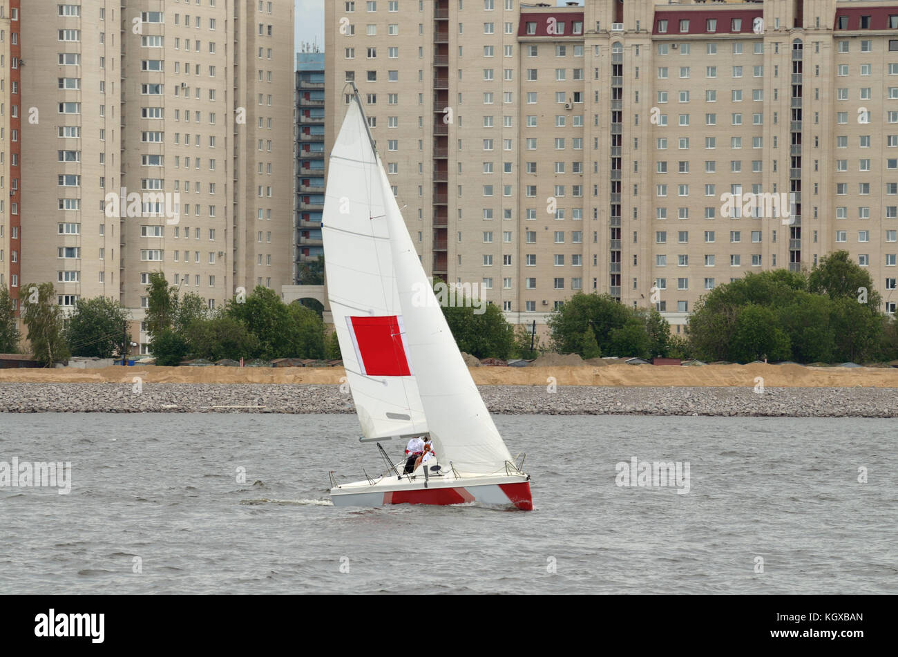 On the river floats boat.The wind blows into its sails.The yacht picks ...