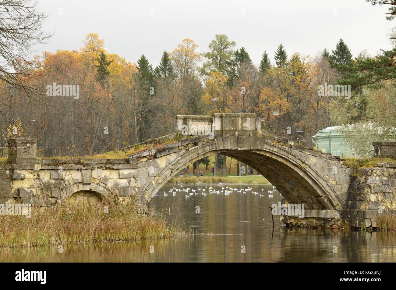 An ancient bridge on the lake connects the two Islands Stock Photo - Alamy