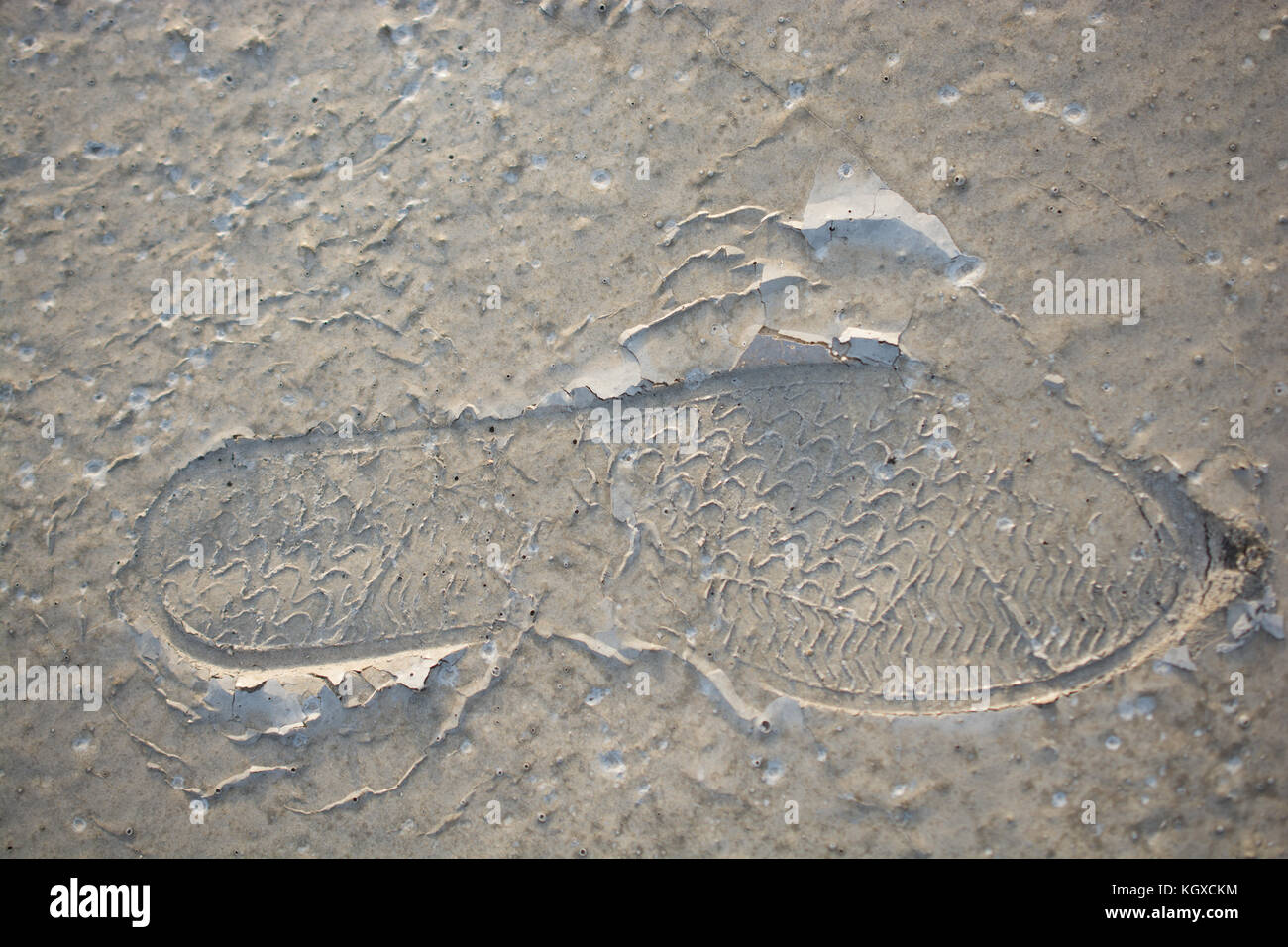 Footstep pattern seen on a concrete background Stock Photo - Alamy