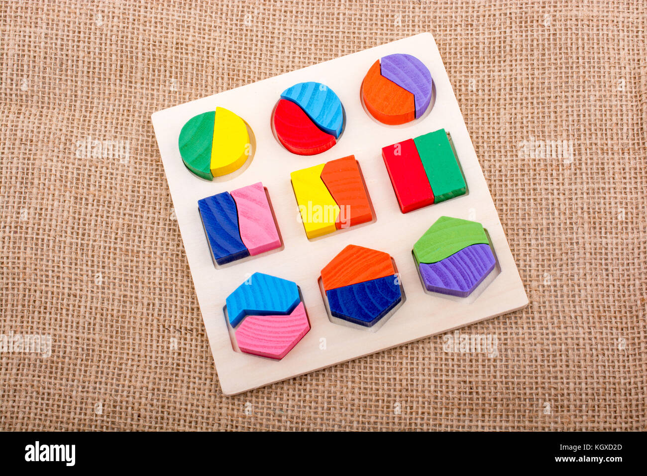 Colorful wooden pieces of a logic puzzle Stock Photo - Alamy