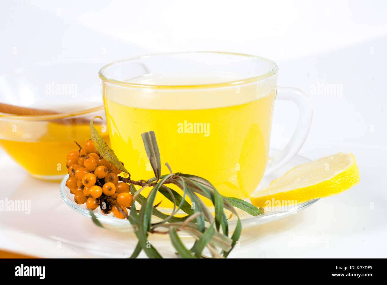 Sea buckthorn tea with a on white background Stock Photo - Alamy