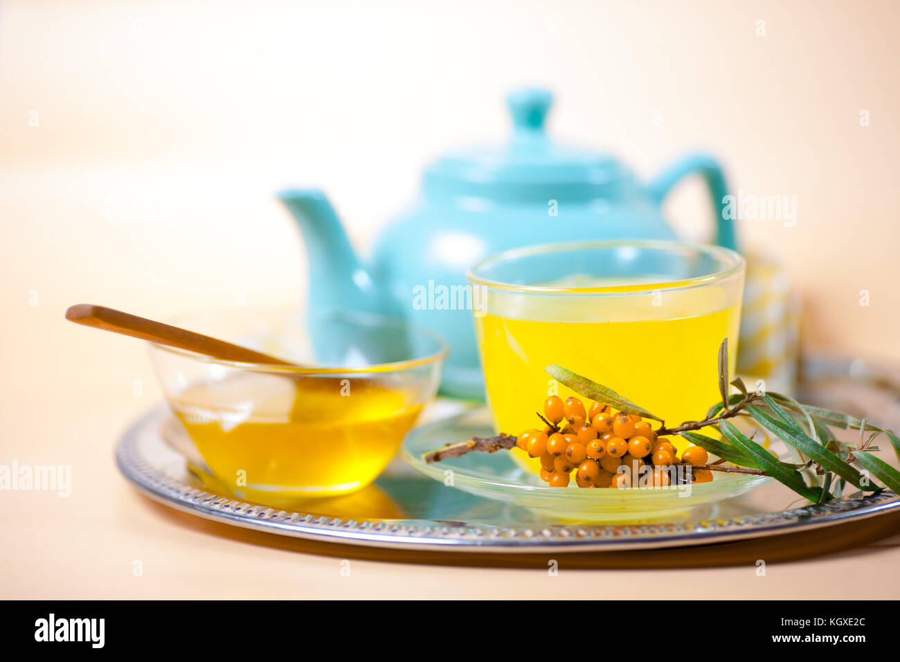 Sea buckthorn tea with a on white background Stock Photo - Alamy