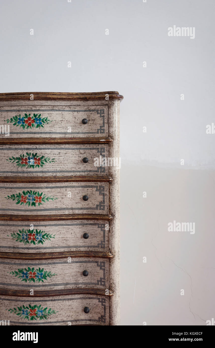 Antique chest of drawers decorated with colors Stock Photo - Alamy