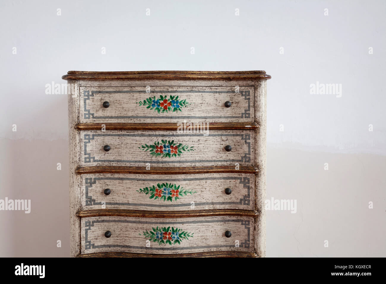 Antique chest of drawers decorated with colors Stock Photo - Alamy