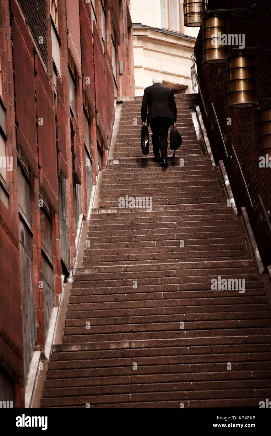 Old man climbing stairs hi-res stock photography and images - Alamy