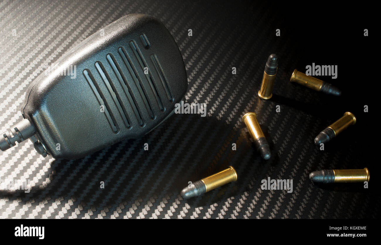 Radio microphone with rim fire bullets on a dark background Stock Photo ...