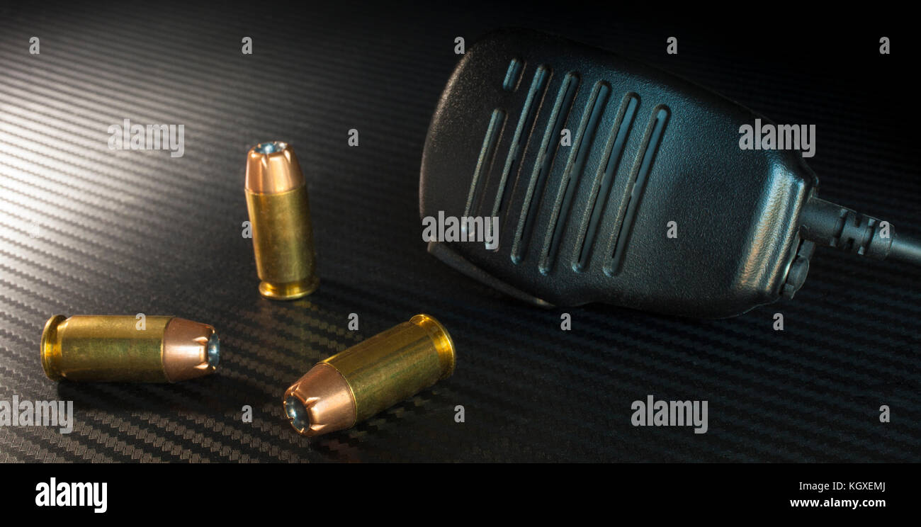 Police microphone with three hollow point handgun cartridges Stock ...