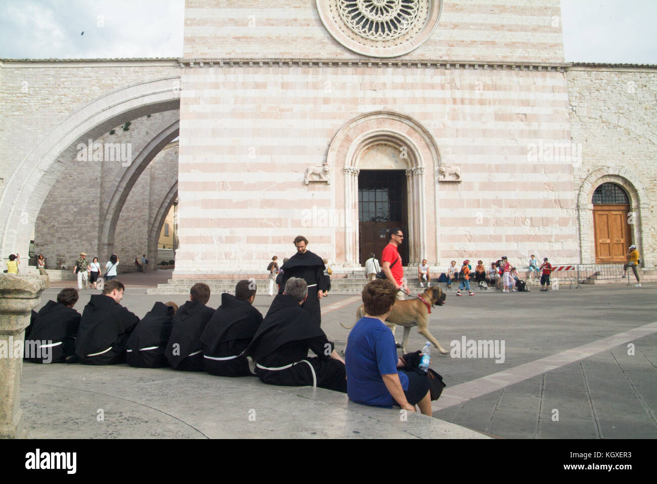 Group of priests relaxing in front of Assisi main church. Umbria, Italy ...
